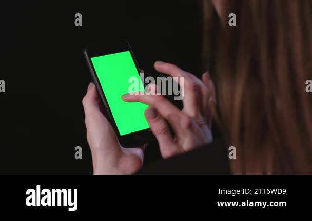 Woman is Holding Phone with green Screen Swipe Stock Video Footage - Alamy