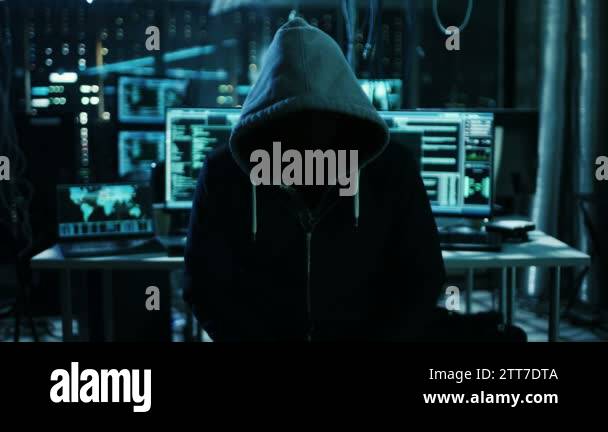 Dangerous Internationally Wanted Hacker with Covered Face Speaks into ...