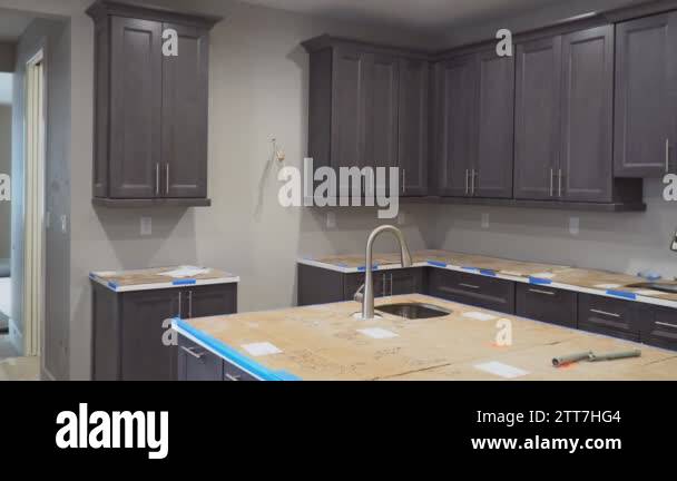 Custom kitchen cabinets in various stages of installation base for of ...