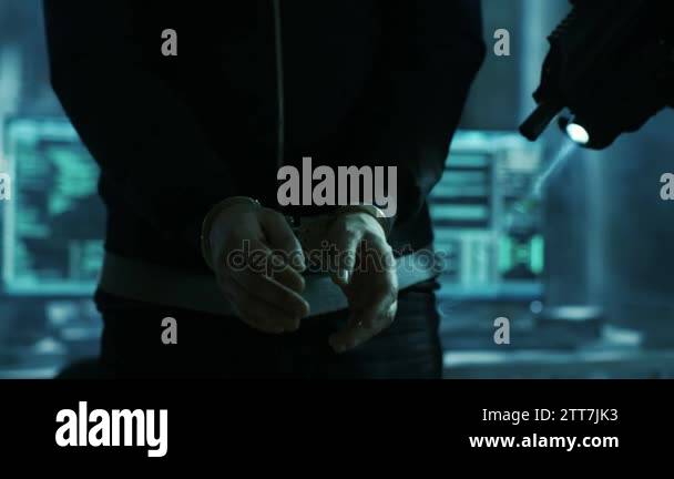 Masked Hacker Wearing Handcuffs is Guarded by Fully Armed Special ...