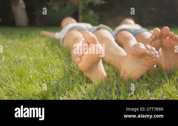 Grass lying feet Stock Videos & Footage - HD and 4K Video Clips - Alamy