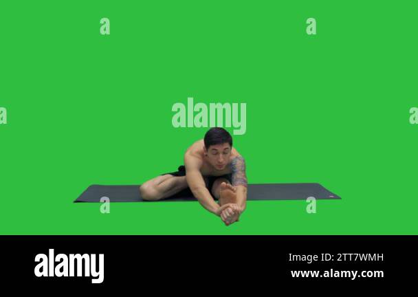 Man in Seated Marichyasana yoga pose stretching leg and spine exercise ...