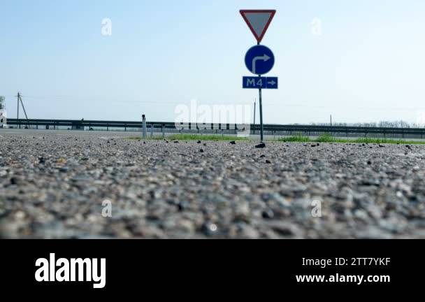 Road sign - entrance to the toll highway M4 Don. Trucks and cars pass ...