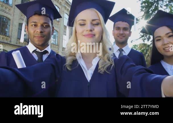 Classmates in academic regalia taking Stock Videos & Footage - HD and ...