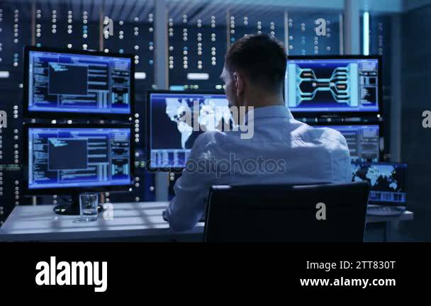 Technical Controller Working at His Workstation with Multiple Displays ...