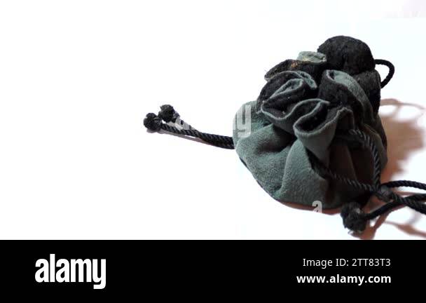 Recorded using a slow shutter speed, a drawstring bag is on the right ...