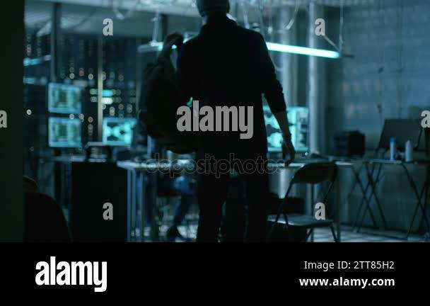 Hooded Teenage Hacker Successfully Attacks Global Infrastructure Servers with Virus. Display ...