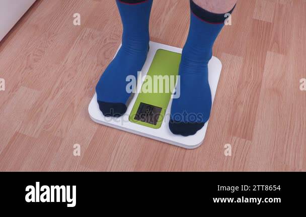 Man using foot scale Stock Videos & Footage - HD and 4K Video Clips - Alamy