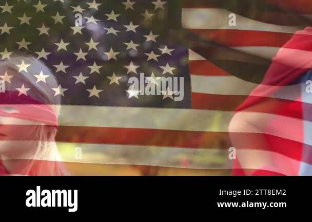 Child playing superhero with cape and costume outside against animated ...