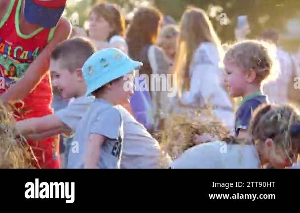 Children playing in the hay Stock Video Footage - Alamy