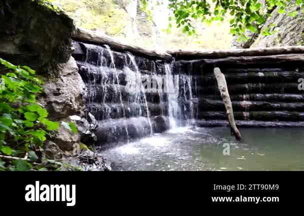 Rural ancient water dam with water flowing Stock Video Footage - Alamy