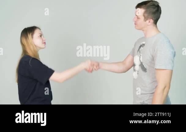 Man and girl shaking hands on white background. Closeup portrait of ...