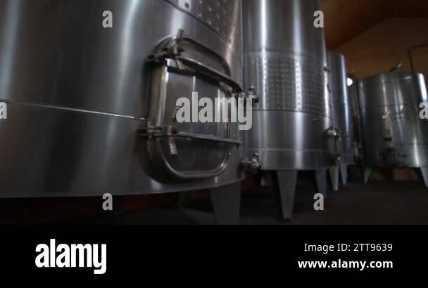Wine production industry, detail of metal tank doors. Quick hand held ...