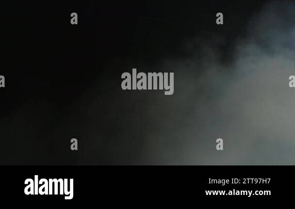 Realistic Smoke / Fog / Gas Moving Fast, Filling Black Background. Real ...
