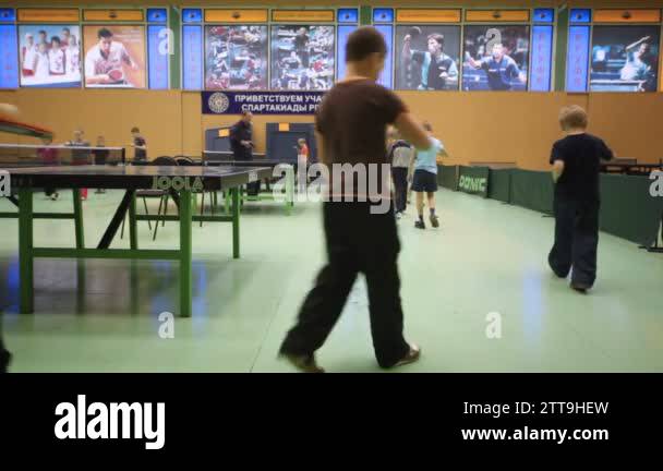 Children go round tables for table tennis in gym Stock Video Footage ...