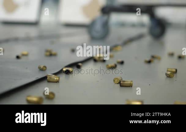 Cases of bullets lying on the floor in the room. Bullet casings in ...