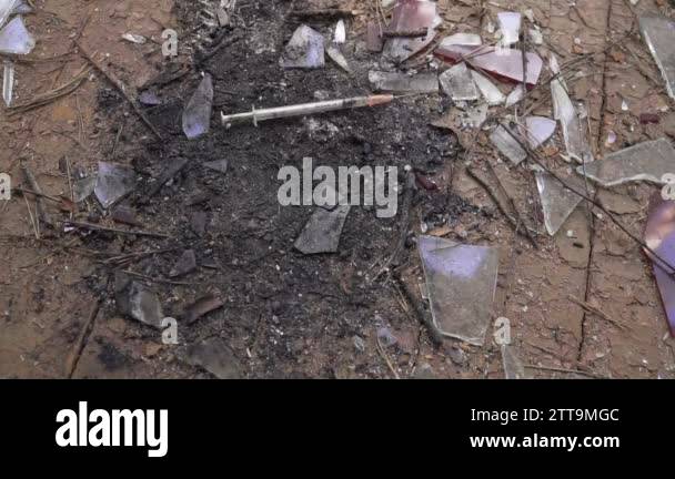 syringe falling down spraying blood after a heroin cocaine injection on ...