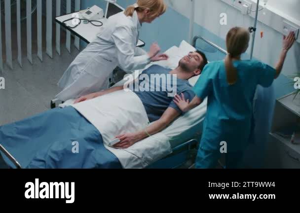 Emergency in the Hospital Doctor and Nurse Rush into the Ward to Safe ...