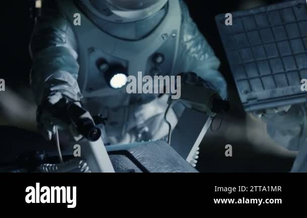 Two Astronauts in Space Suits on an Alien Planet Prepare Space Rover for Planet's Surface ...