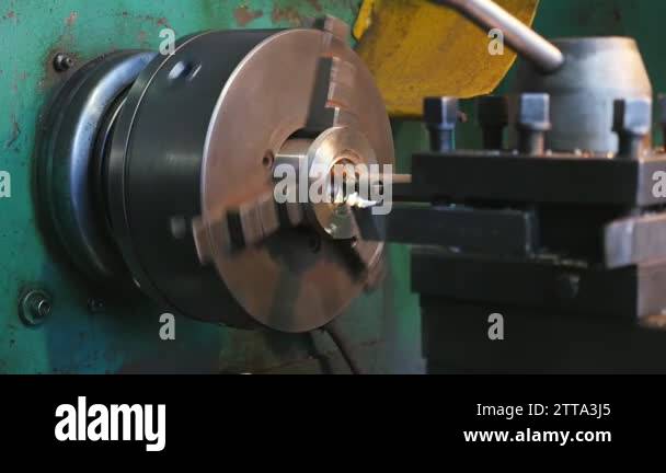 Rotating cylinder on a lathe machine turning right and left in a big ...