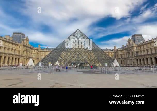 The large glass pyramid and the main courtyard of the Louvre Museum ...