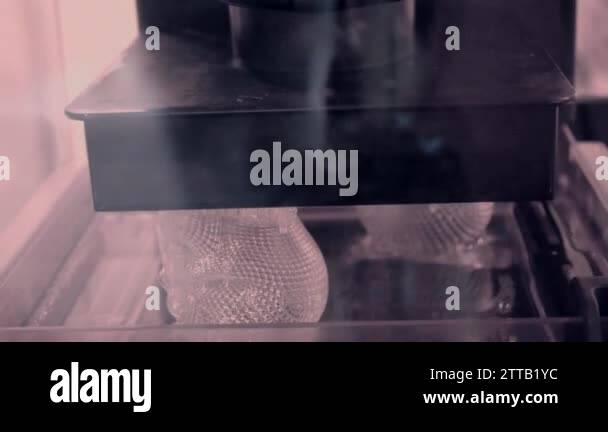 Stereolithography DPL, SLA 3d printer creating shape by UV ...