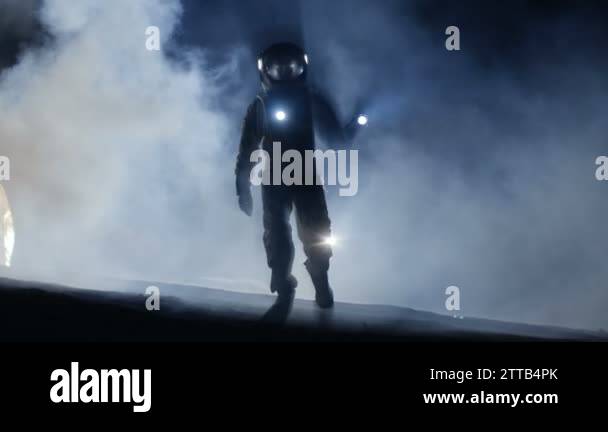 Courageous Astronaut in the Space Suit Holds Flashlight and Explores ...