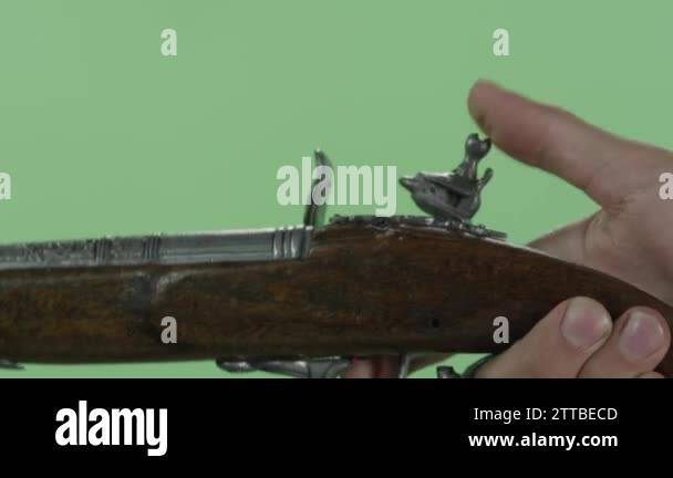 Man with an old pistol. Vintage antique flintlock pistol isolated on ...