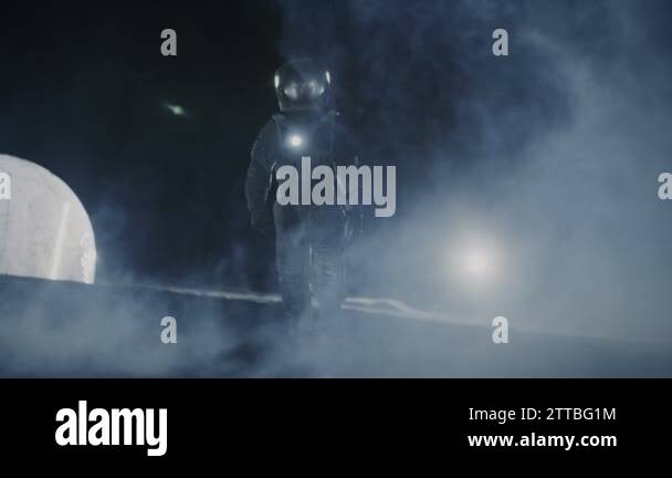 Courageous Astronaut in the Space Suit Holds Flashlight and Explores ...