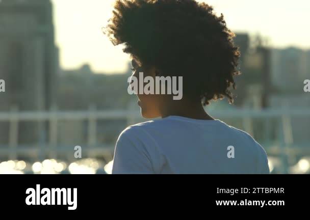 Excited african american woman enjoying morning sun outdoors, joy, back ...