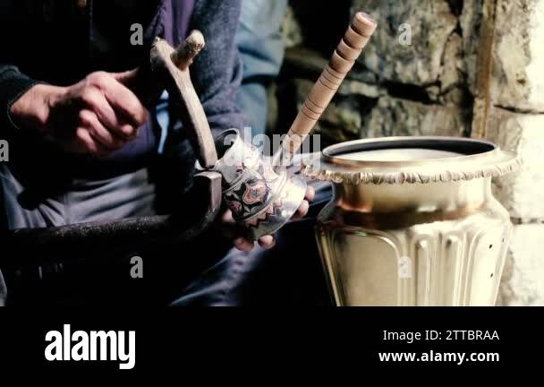 Traditional tinsmith work. Copper smith makes embossing artifacts from ...