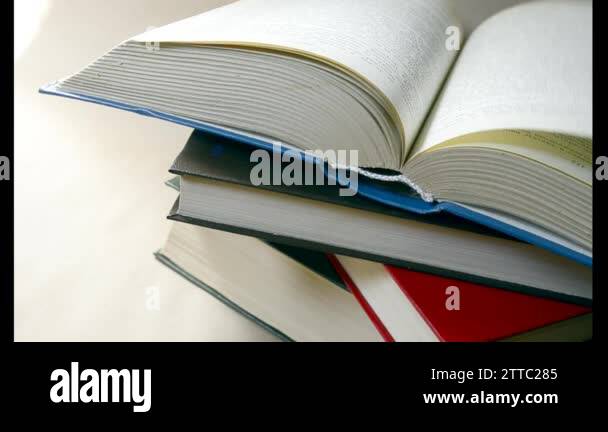 Library piles and stacks novel Stock Videos & Footage - HD and 4K Video ...