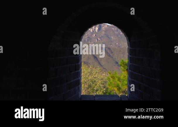 Steadicam shot of the Chinese Great wall that rises up the side of the ...