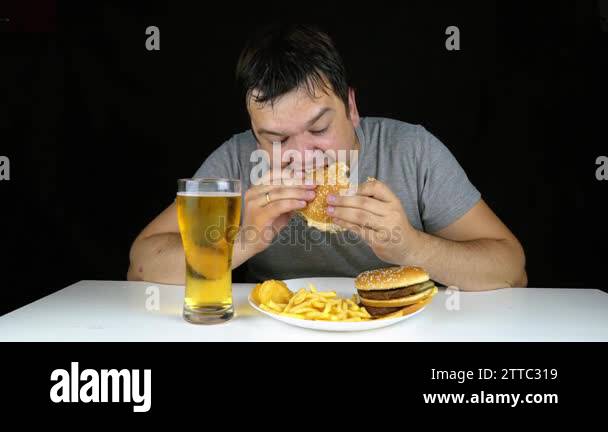 Man eating burger drinking Stock Videos & Footage - HD and 4K Video ...