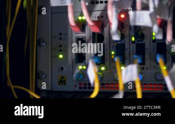 Blinking orange light illuminates insides of a network switch Stock ...