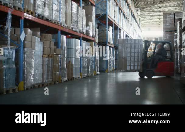 Forklift Loader is Moving Cargo Goods in Logistic Warehouse Stock Video ...