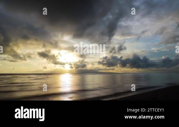 A colorful sunrise video facing the ocean from Dumaguete City shores ...