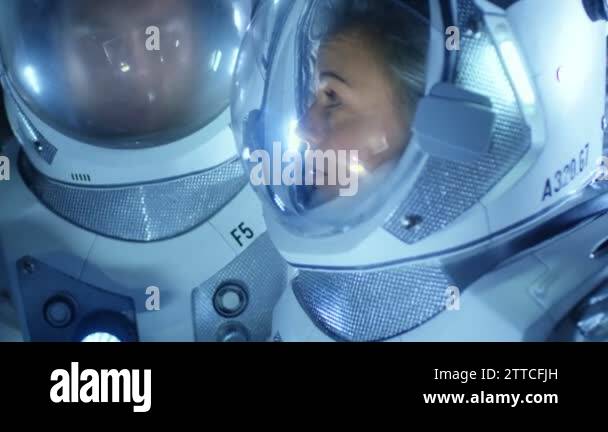 Two Astronauts Wearing Space Suits Talking, Exploring Newly Discovered Planet, Communicating ...