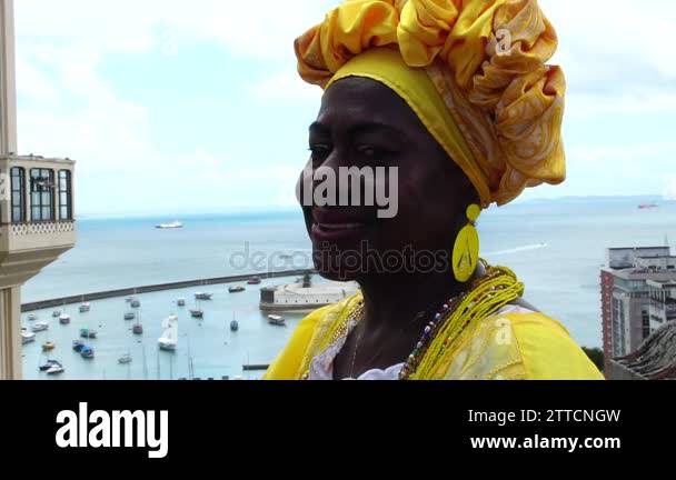 Brazilian Woman Of African Descent Smiling Dressed In Traditional Baiana Attire In Elevator