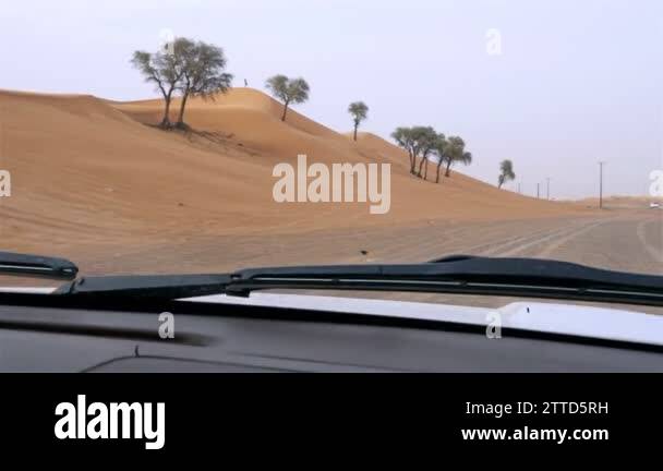 4x4 off road land vehicle taking tourists on desert dune bashing safari ...