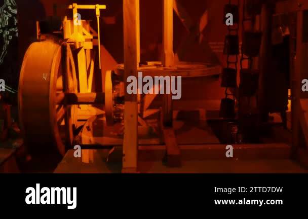 Skillful water mill sample with a rotating wheel, pouring water and ...