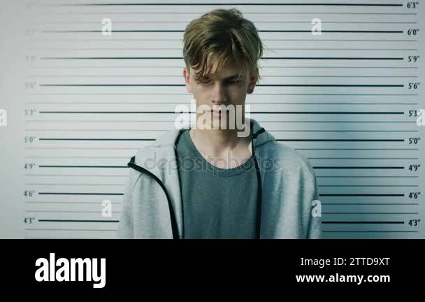 In a Police Station Arrested Teenage Delinquent Poses for Side, Front ...