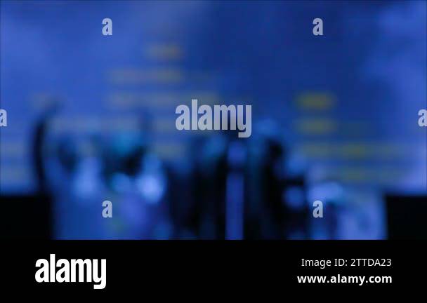 People sing and dance in a disco in night club. The image blur. Light ...