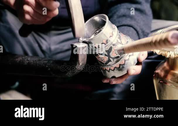 Traditional tinsmith work. Copper smith makes embossing artifacts from ...