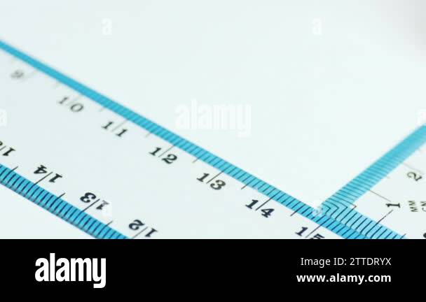 The engineer draws parallel lines in the drawing with a ruler and a ...