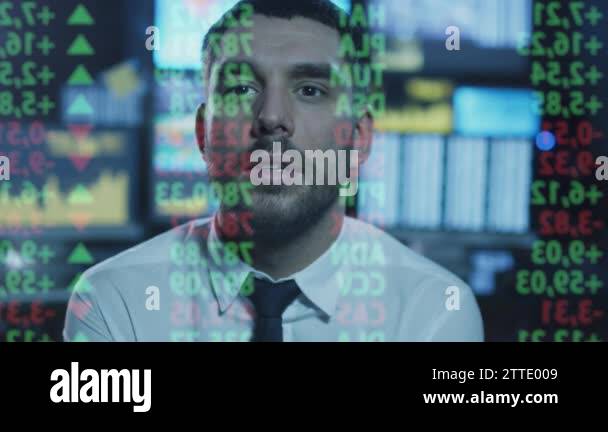 Stockbroker is looking at data with numbers on a transparent glass ...