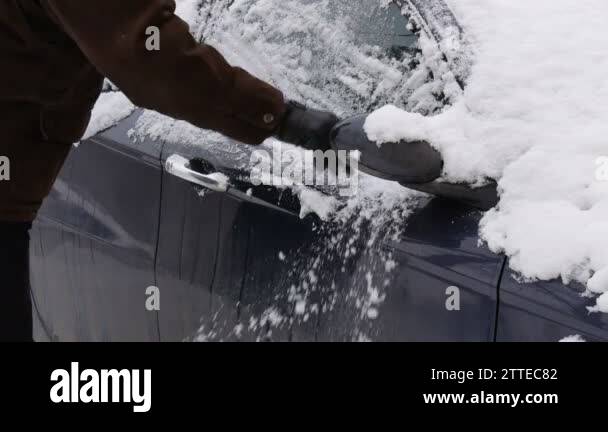 Driver cleaning snow from car, unlock, opening and closing door, winter ... Driver cleaning snow from car, unlock, opening and closing door, winter ...