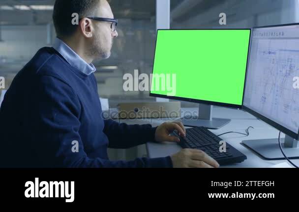 Chief Male Engineer Working on Technical Project on His Person Computer ...