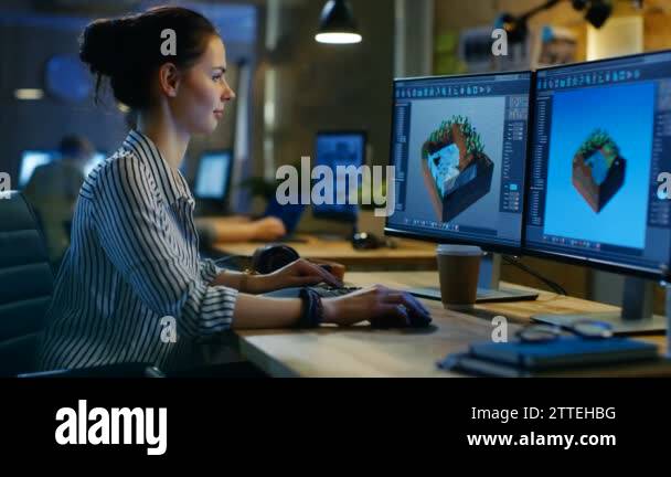 Female Game Developer Works on a Level Design on Her Personal Computer ...