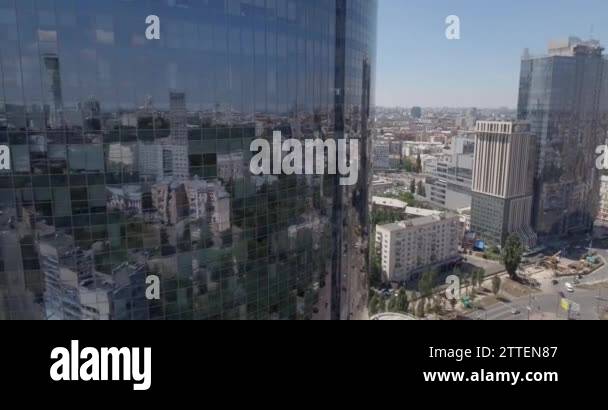 AERIAL. loseup skyscraper glass windows, business buildings district ...